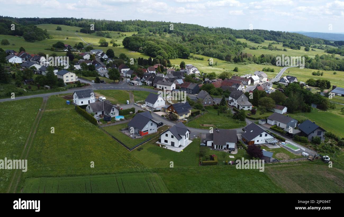 An aerial view of modern buildings surrounded by trees Stock Photo - Alamy