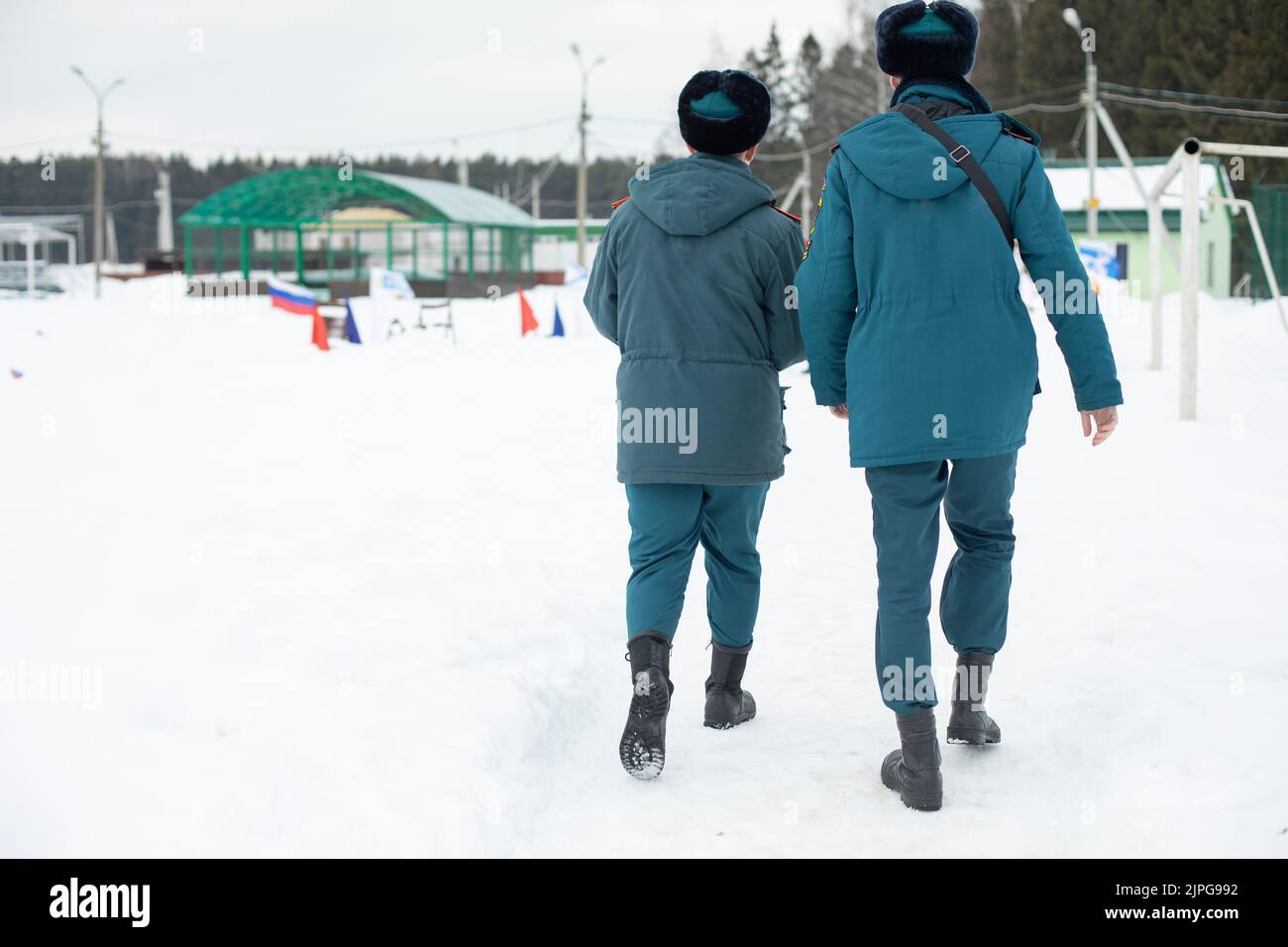 Two guys in uniform. Men come from service in Russia. People in warm ...