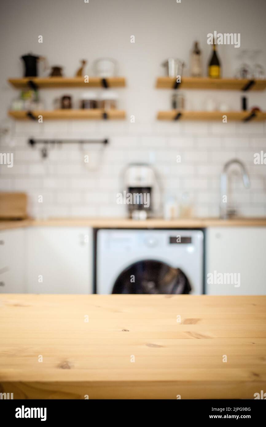 empty wooden tabletop and blurred kitchen mock up for product display ...