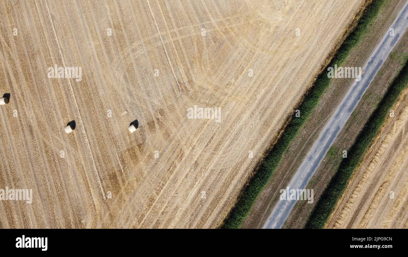 Hay bales in field tractor hi-res stock photography and images - Alamy