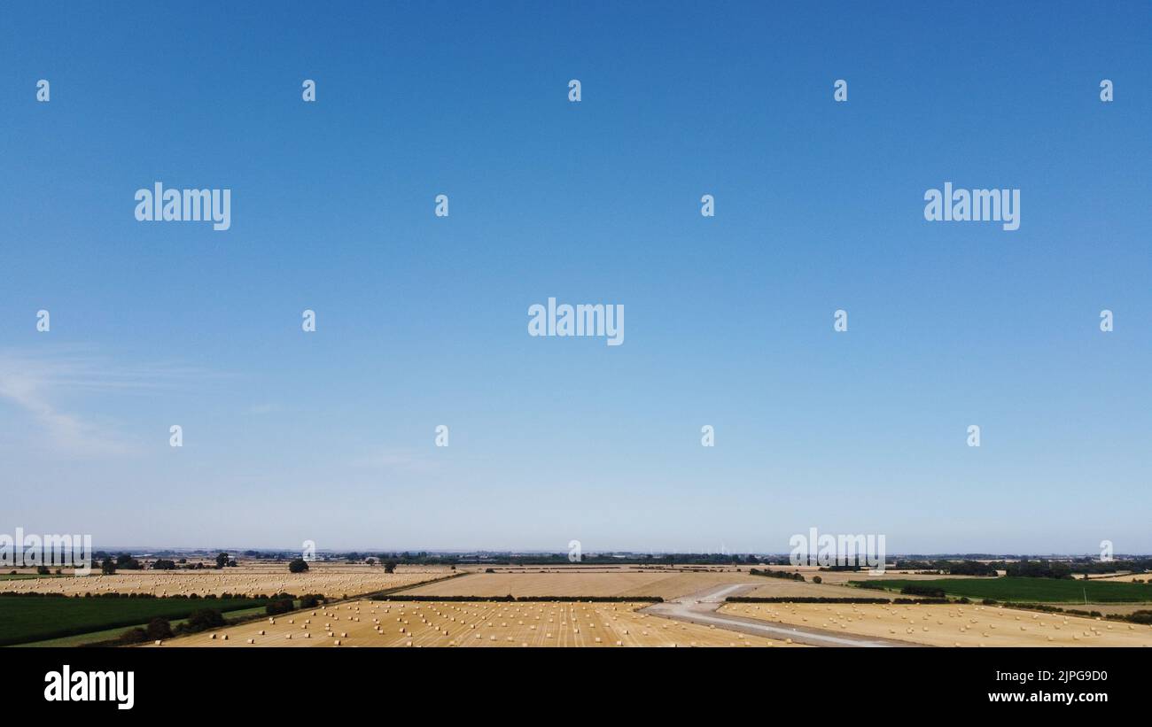Aerial view of farmers' fields below blue summer sky Stock Photo - Alamy