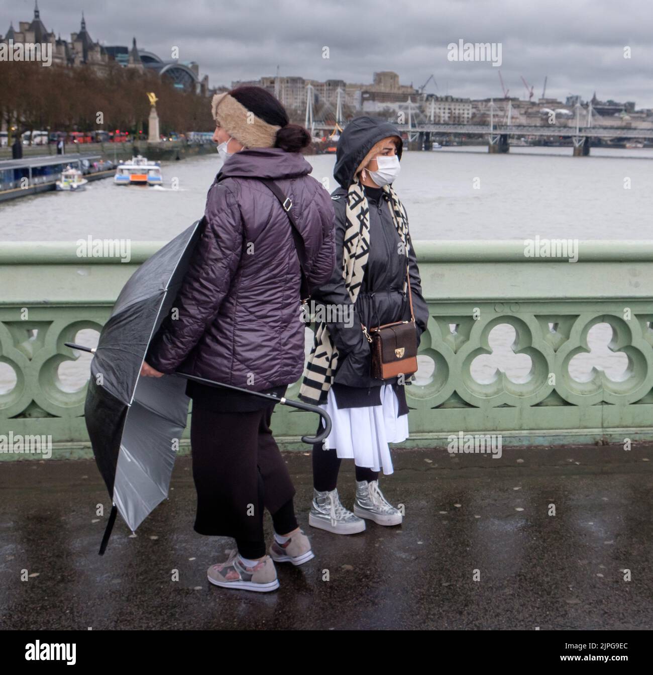 People in the wind and rain on Westminster Bridge Stock Photo - Alamy