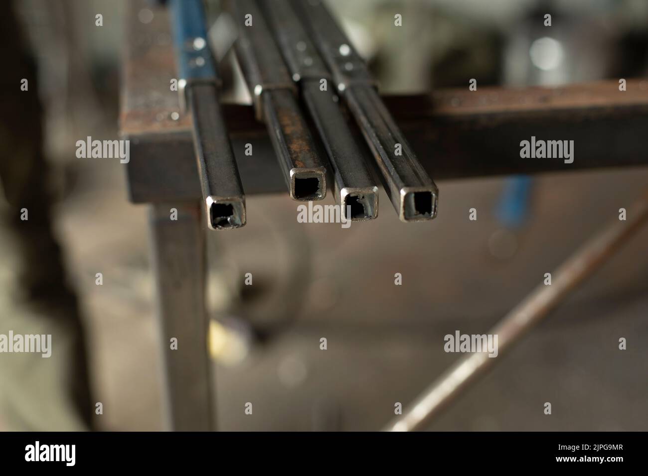 Steel parts. Rods made of metal. Details of steel working workshop ...