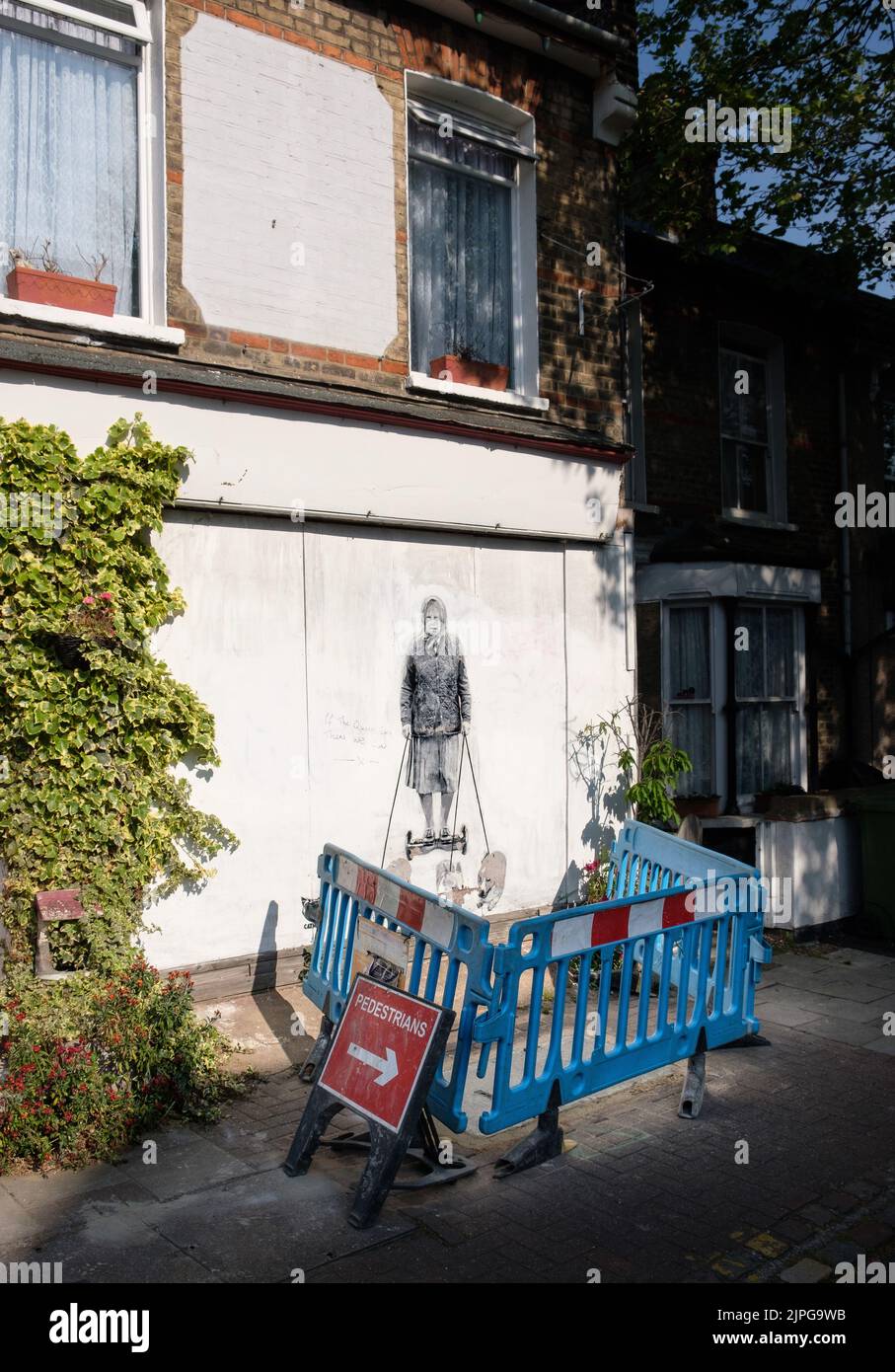 During the Coronavirus (Covid-19) lockdown, barriers surround a mural ...