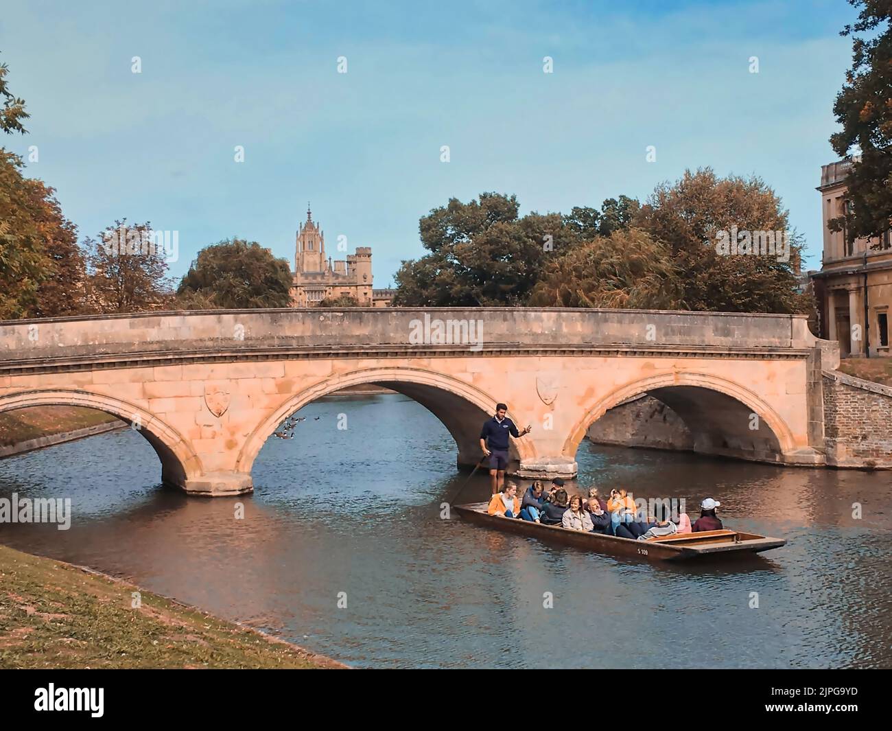 The Cambridge boat tour in a river against a scenic bridge in the ...