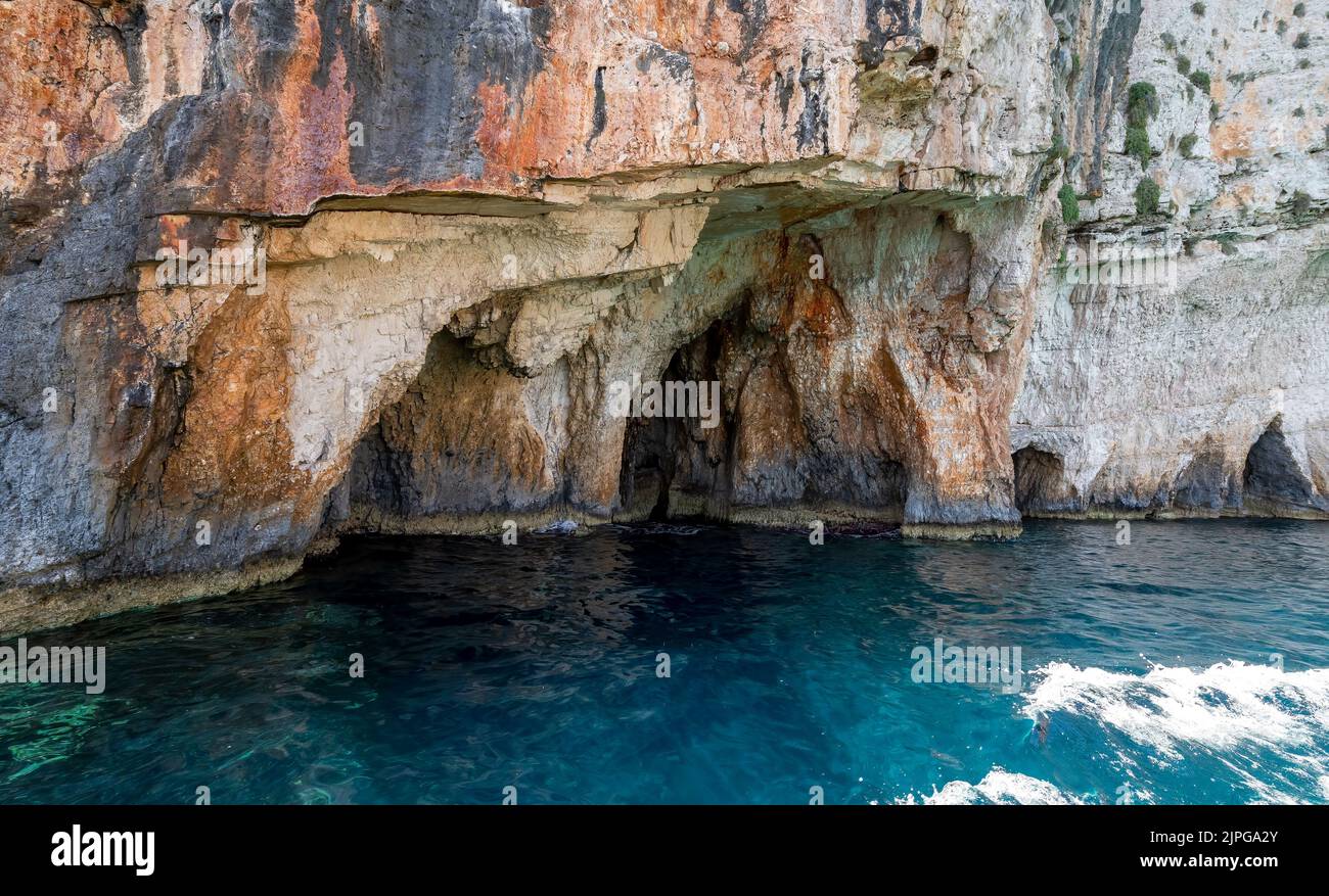 Scenic white caves around the azure sea in Zakynthos, Greece Stock ...