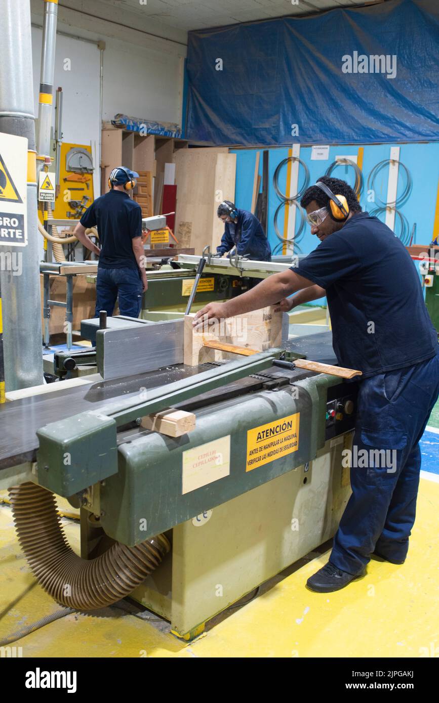 Carpenter man using mechanical planer tool in carpentry Stock Photo - Alamy