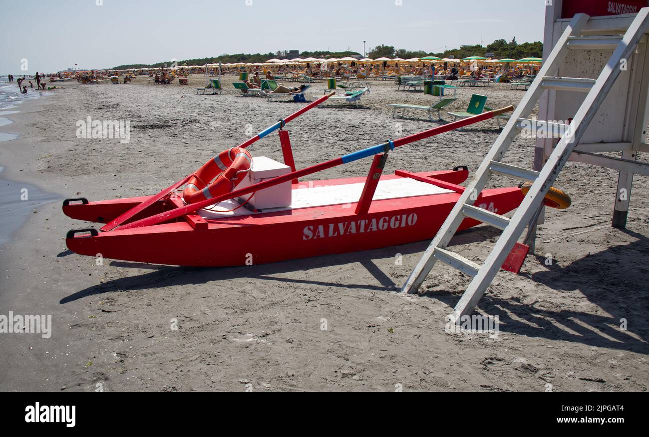 Red lifeguard rescue boat. The word "Salvataggio, Rescue" written on ...