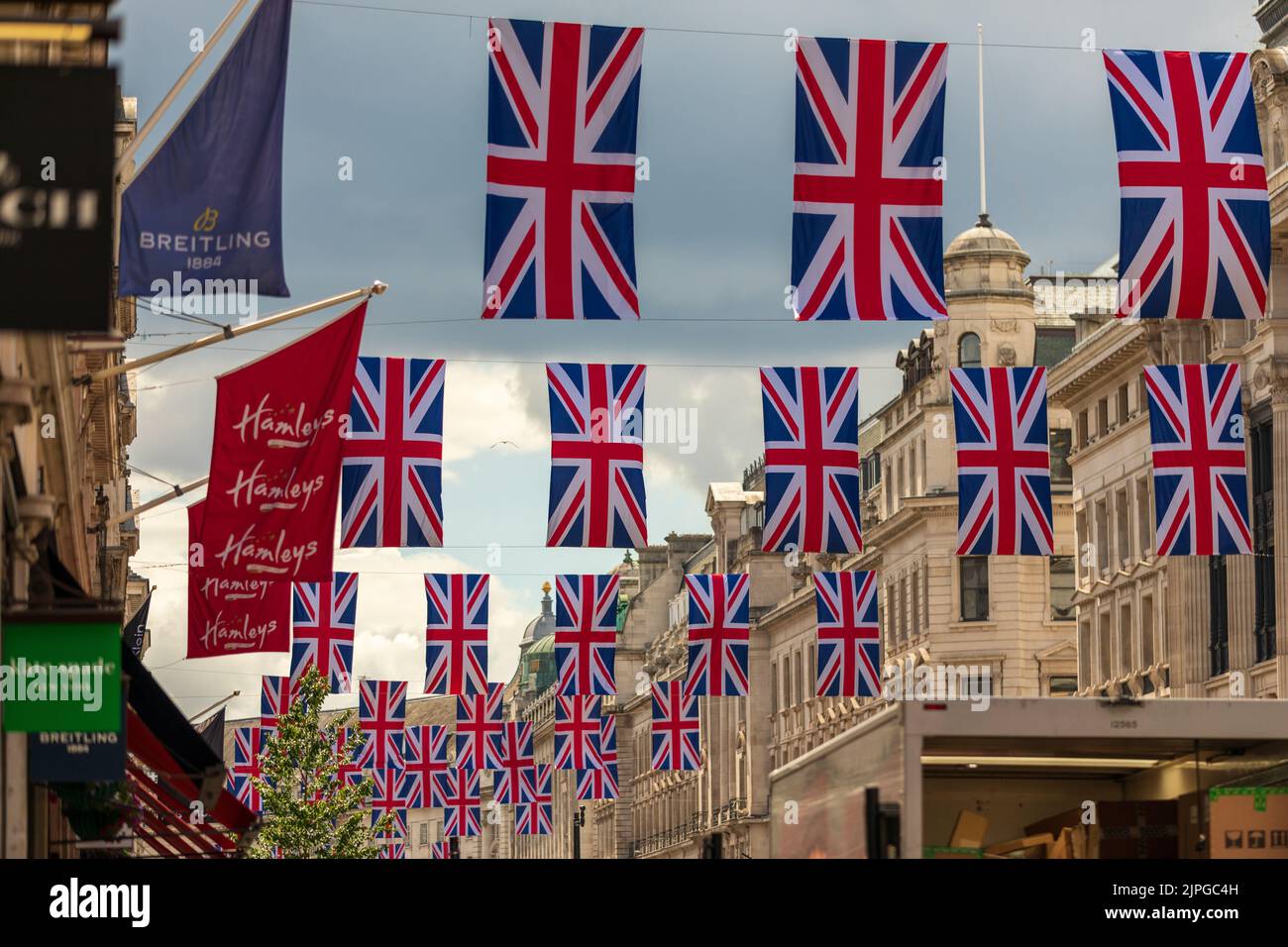 A beautiful shot of British flags hanging on the street before the ...