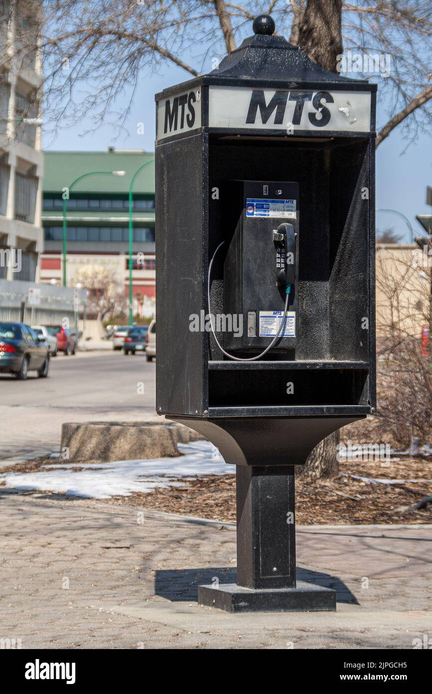 A vertical shot of an old telephone booth on a city street. Winnipeg ...