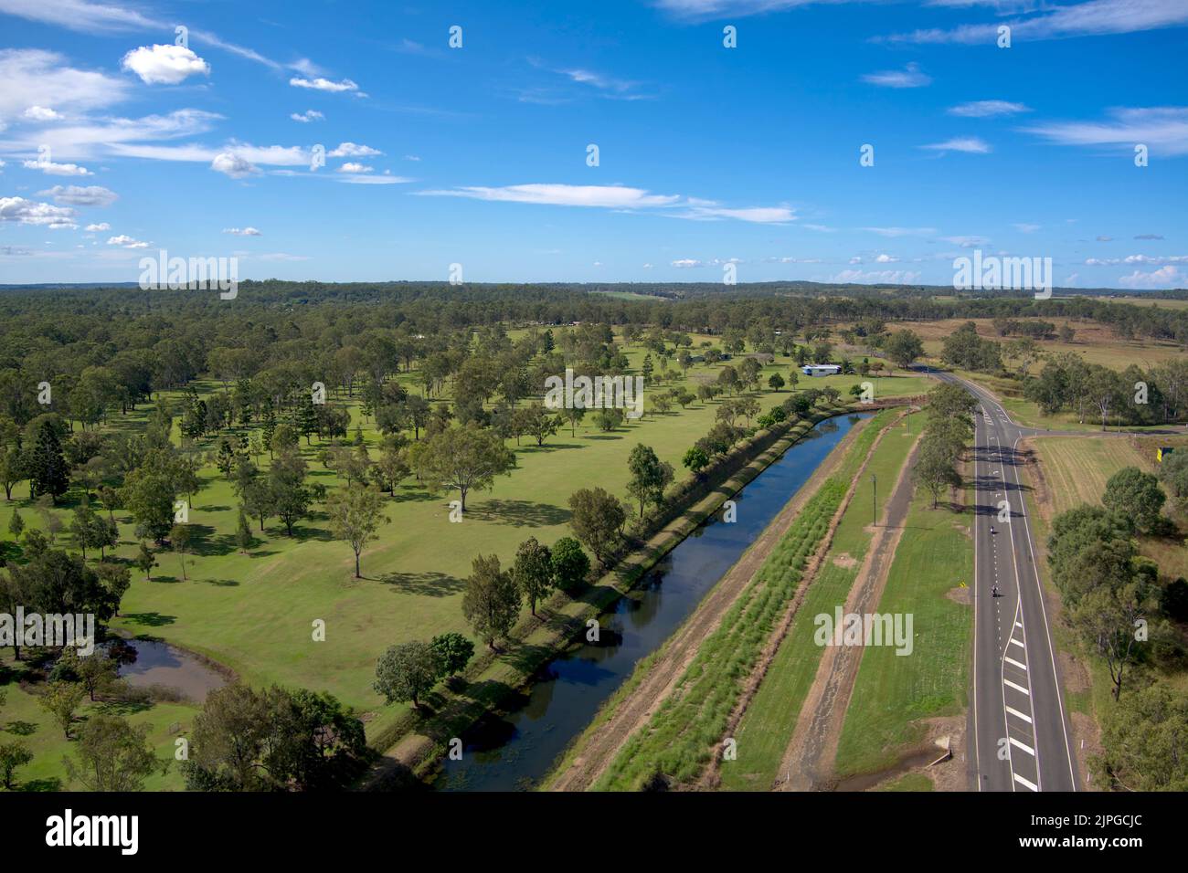Aerial of Golf Course and irrigation canal from Lake Monduran at Gin ...