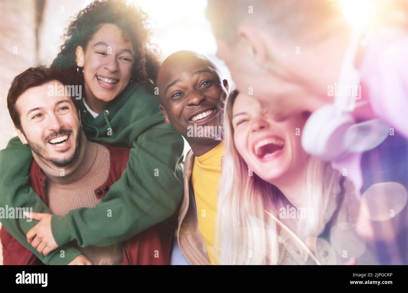 Multiracial friends group having fun in city stret in vacations - Happy young people laughing ...