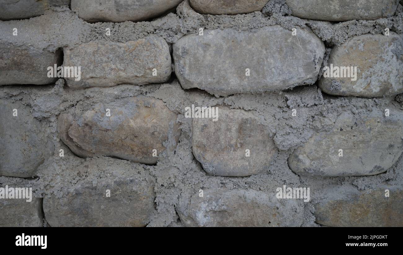 Old castle stone wall texture background. Finishing the facade with ...
