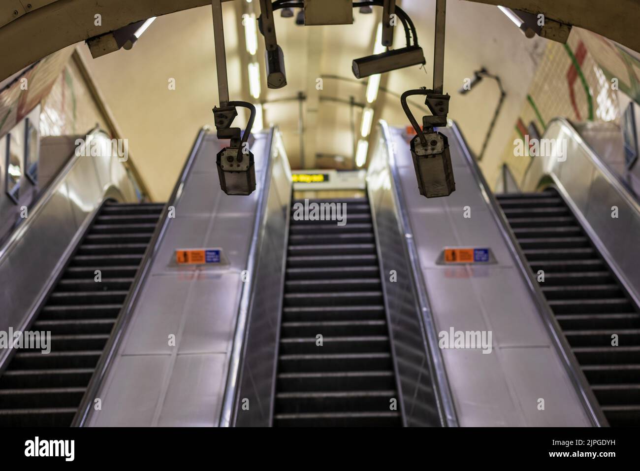 A low-angle shot of two CCTV cameras in the Picadilly Circus ...