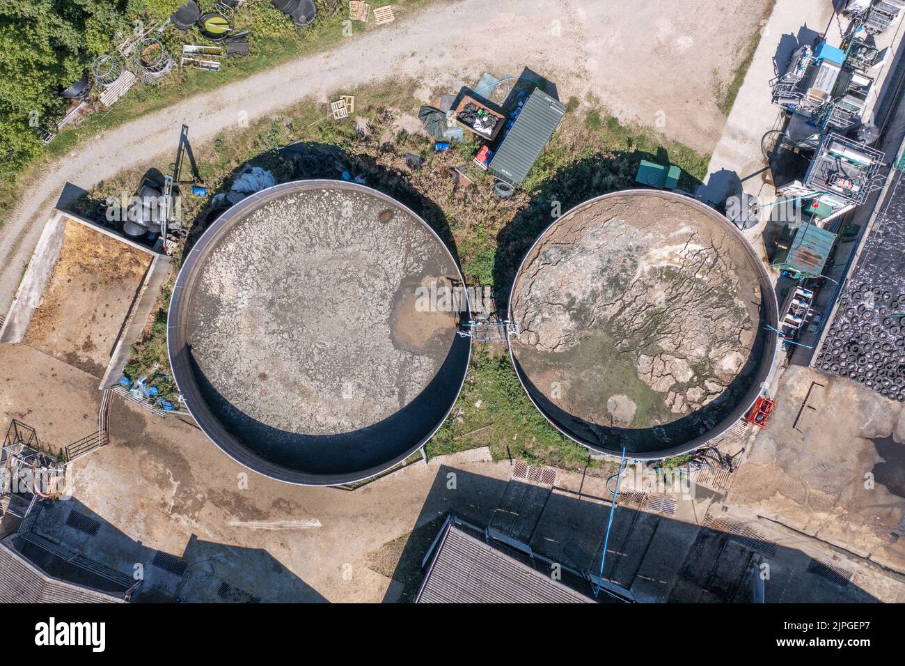 Aerial view of dairy farm showing slurry tanks, Towy Valley ...