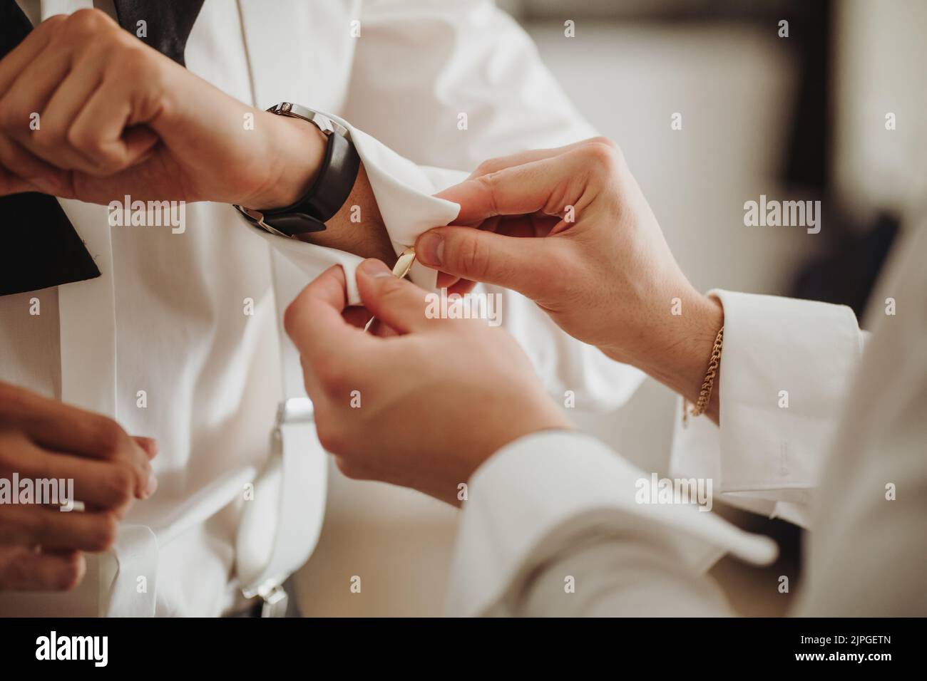 Hands buttoning a white shirt hi-res stock photography and images - Alamy