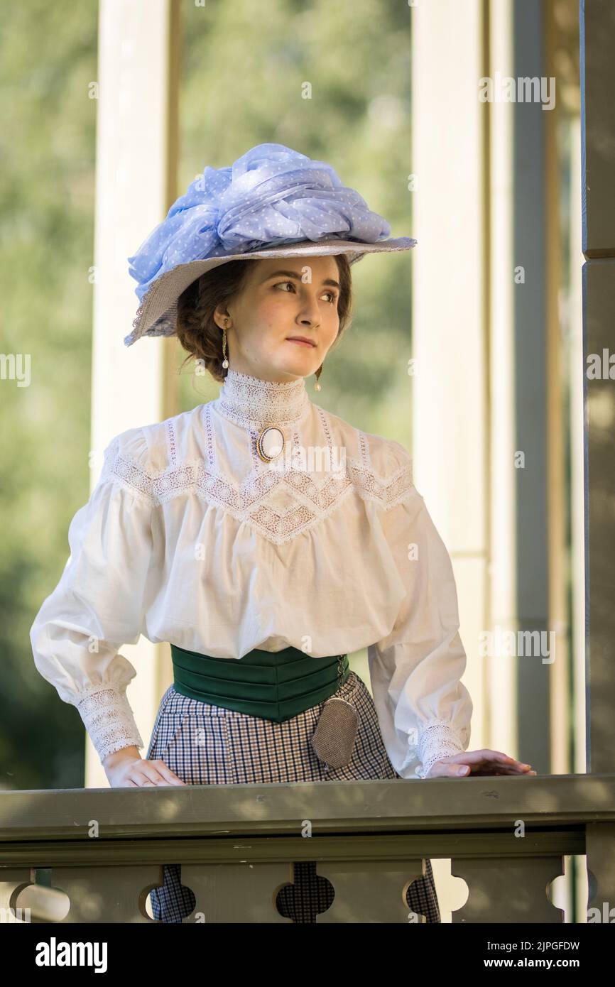 Portrait of a young slender woman in a 1910s costume. A woman in an ...