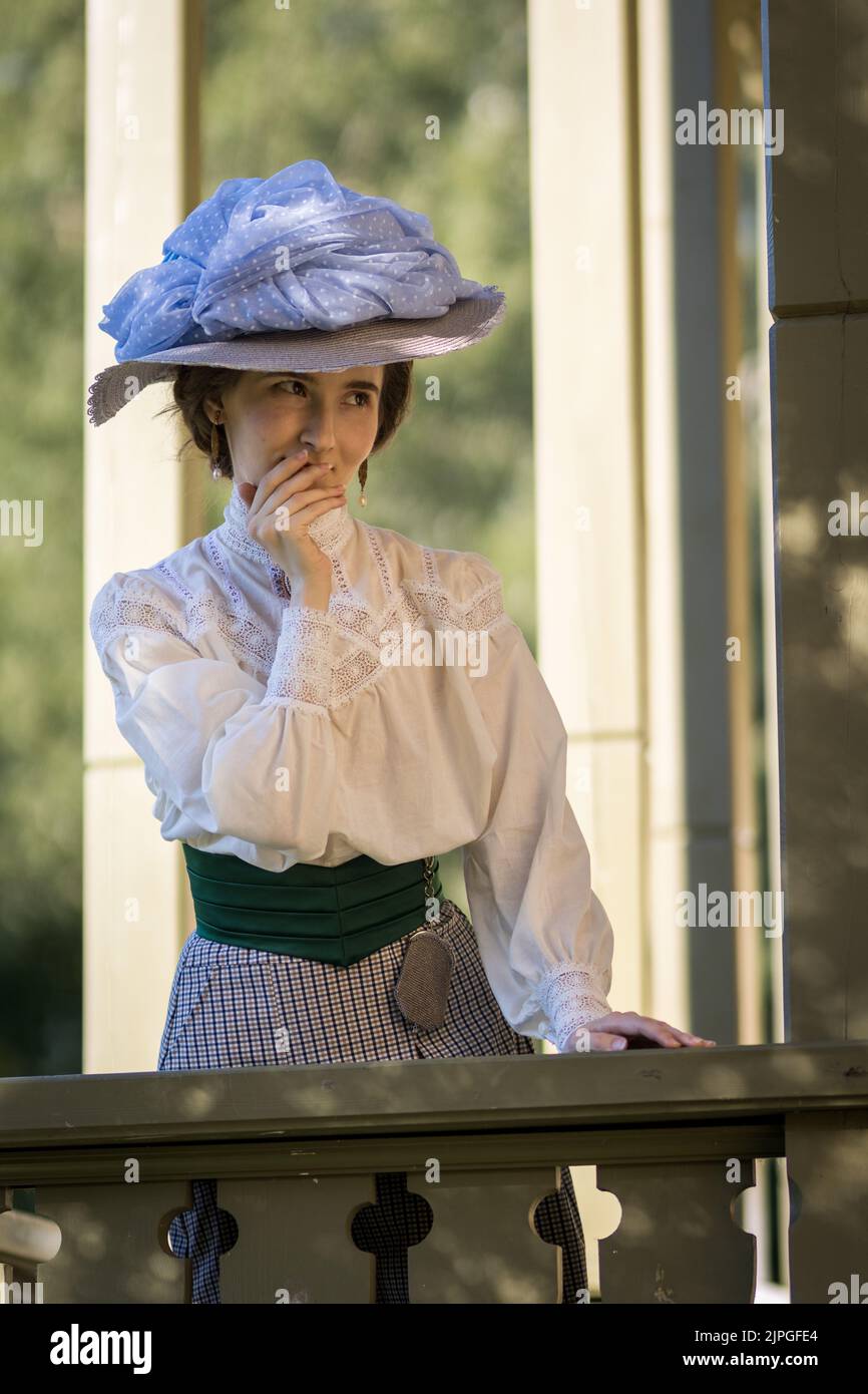 Portrait of a young slender woman in a 1910s costume. A woman in an ...