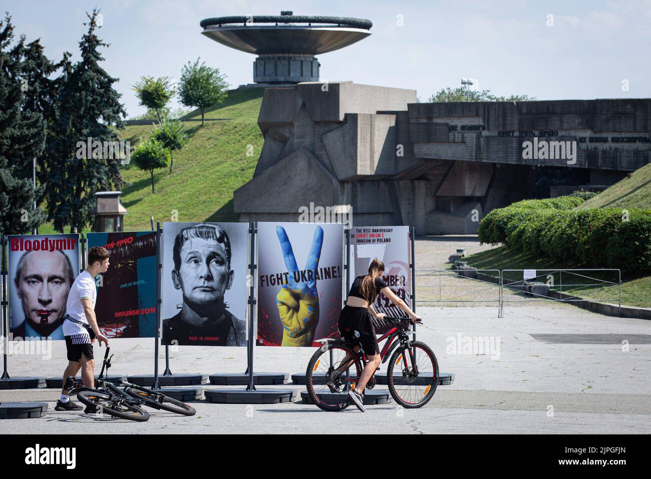 Kyiv, Ukraine. 17th Aug, 2022. People walk past a poster with the ...