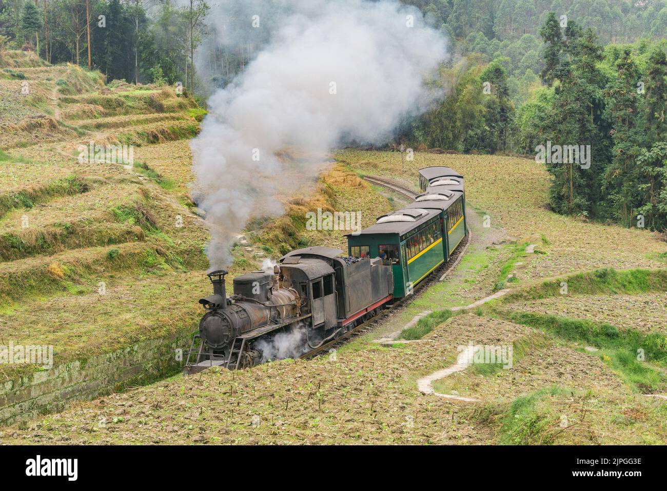 Steam narrow-gauge train moves from Yuejin to Bagou through the chinese ...