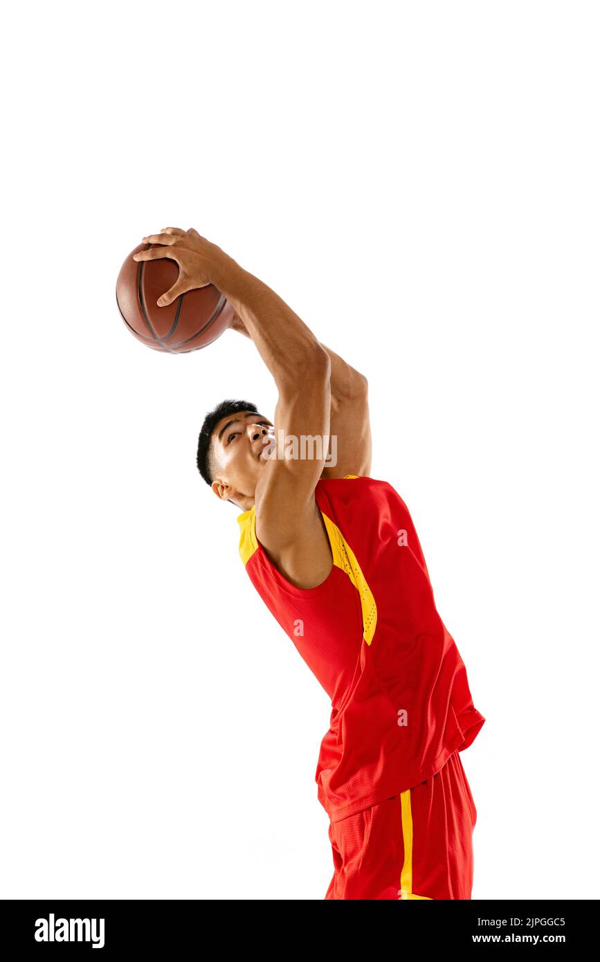 Portrait of muscular young man, basketball player scoring winning goal ... Portrait of muscular young man, basketball player scoring winning goal ...