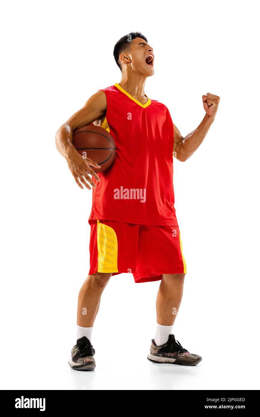 Portrait of young man, basketball player isolated over white studio ...