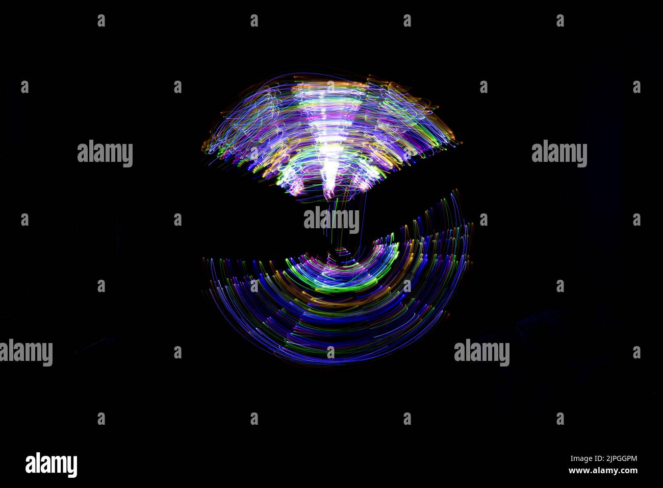 Light painting forming a graphic design around a dark eye against a ...