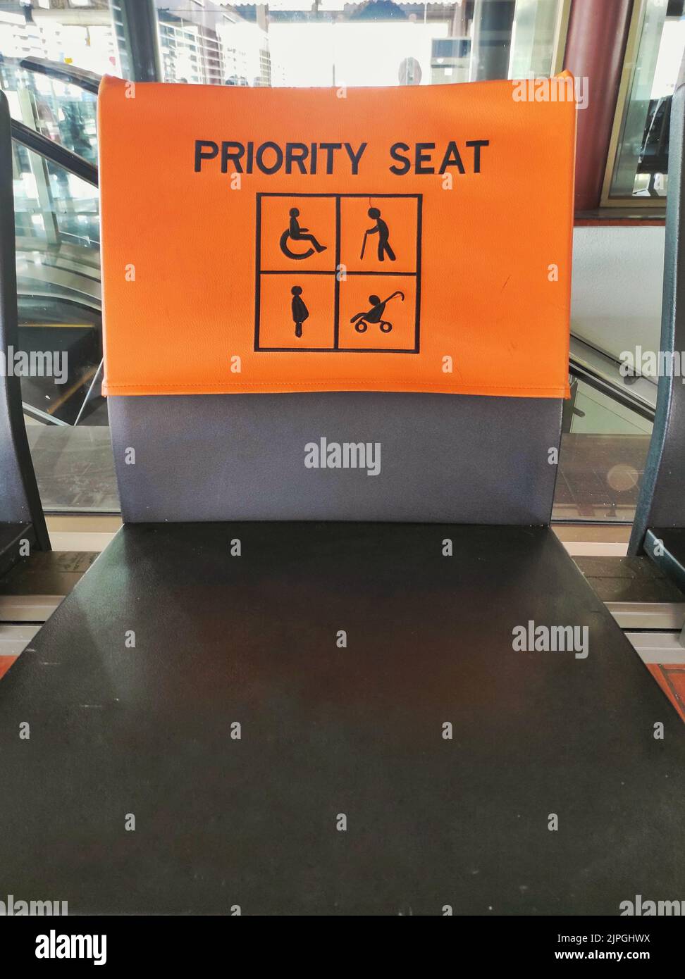 Empty seats at gate orange black Priority Seating in airport. for ...