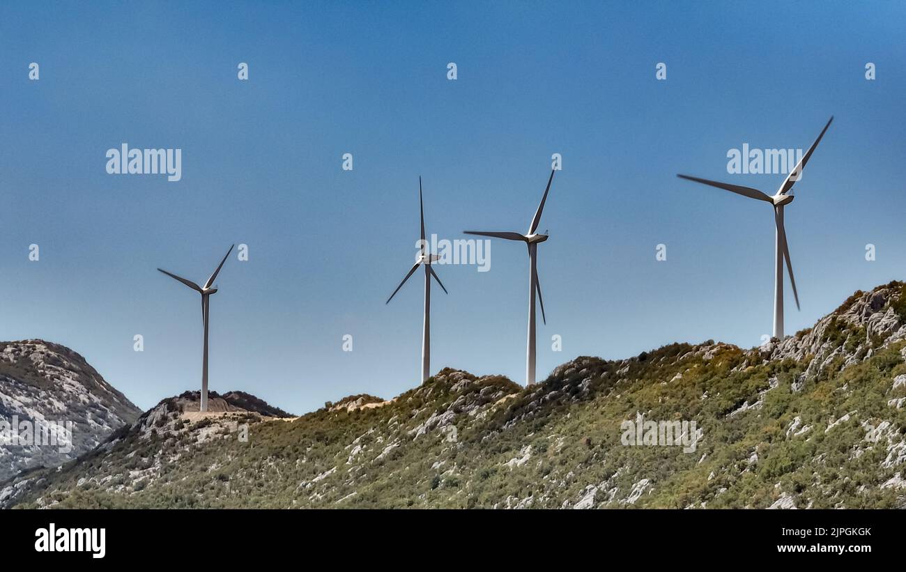 Aerial view of wind power turbines, on top of mountains in eastern ...