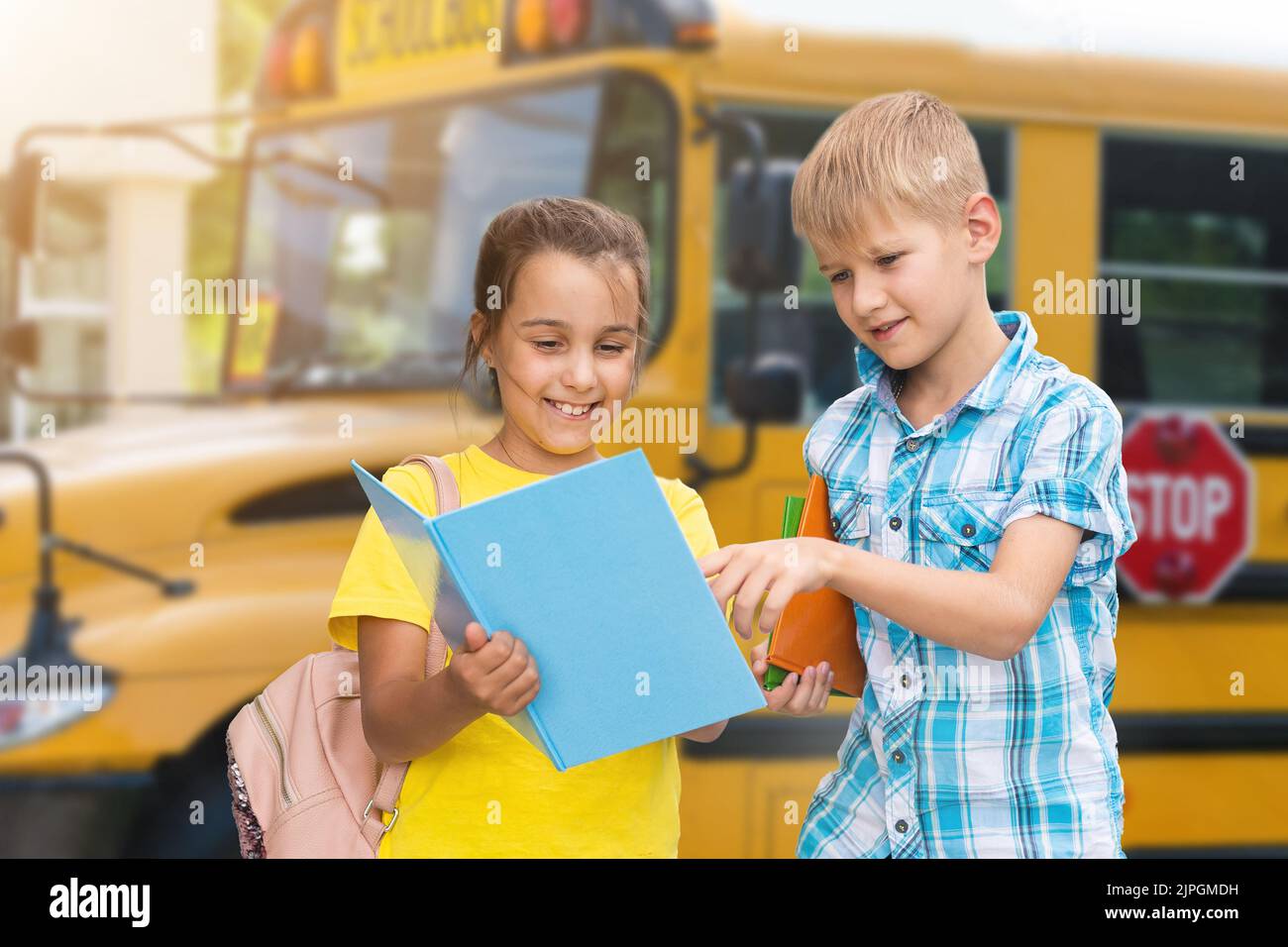Little kids schoolchildren pupils students, the school bus. Welcome ...