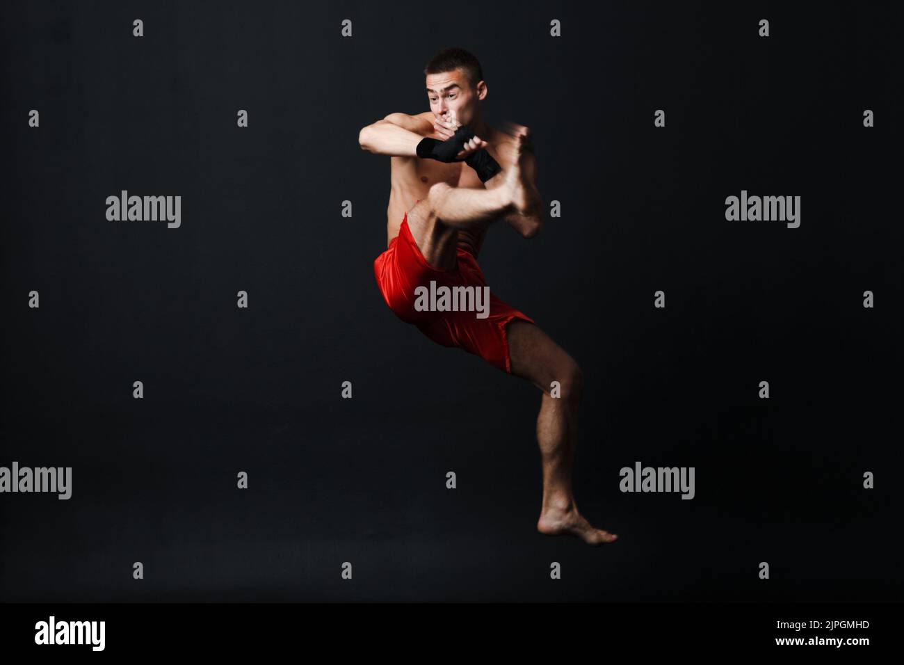 Sportsman muay thai man boxer stance at black background Stock Photo ...