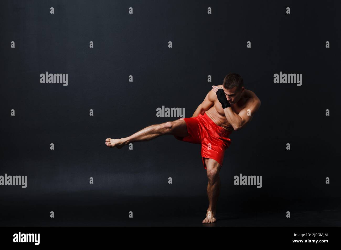 Sportsman muay thai man boxer stance at black background Stock Photo ...