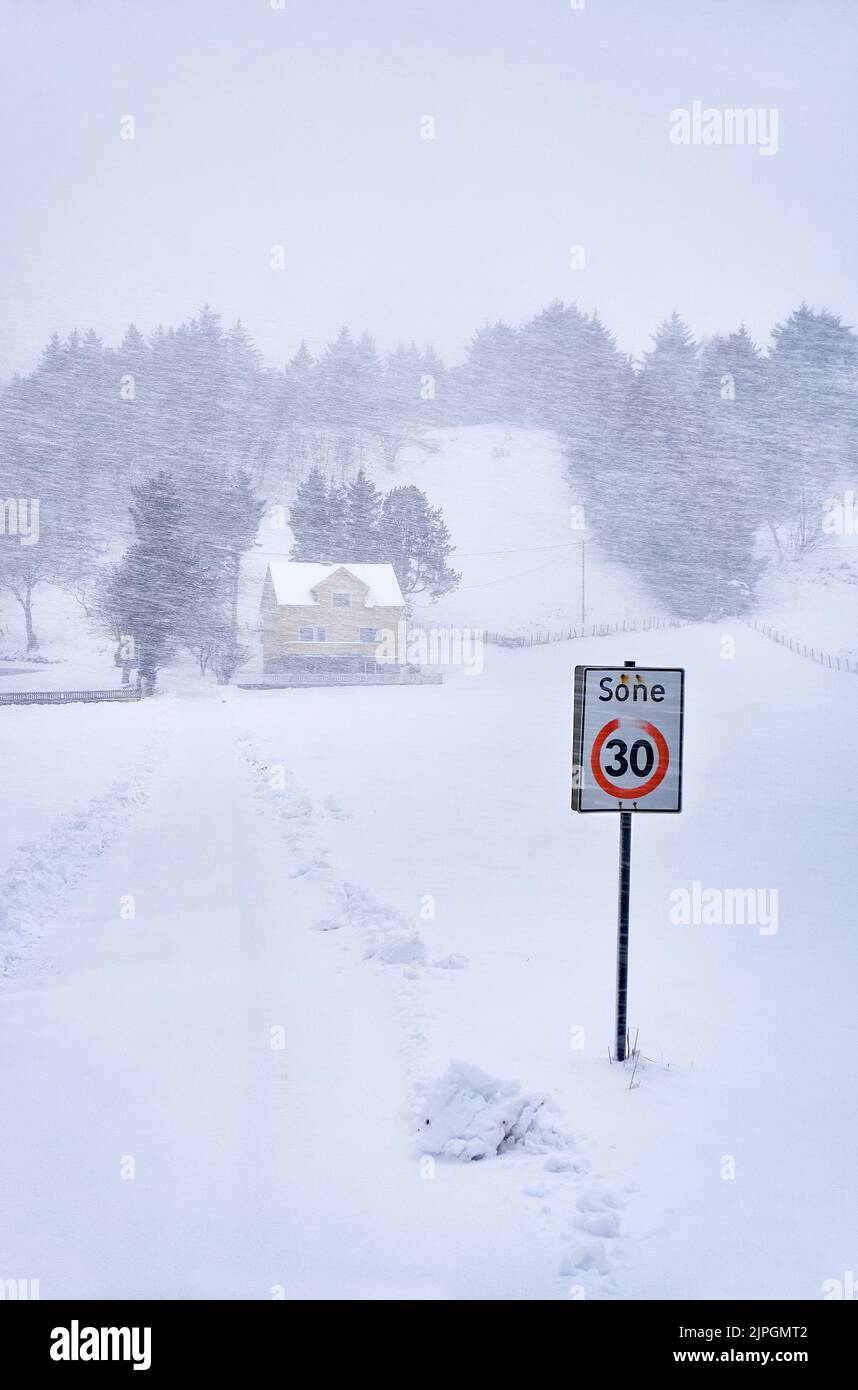 Streetsign during a cold winter blizzard on Godøy, Sunnmøre, Møre og ...