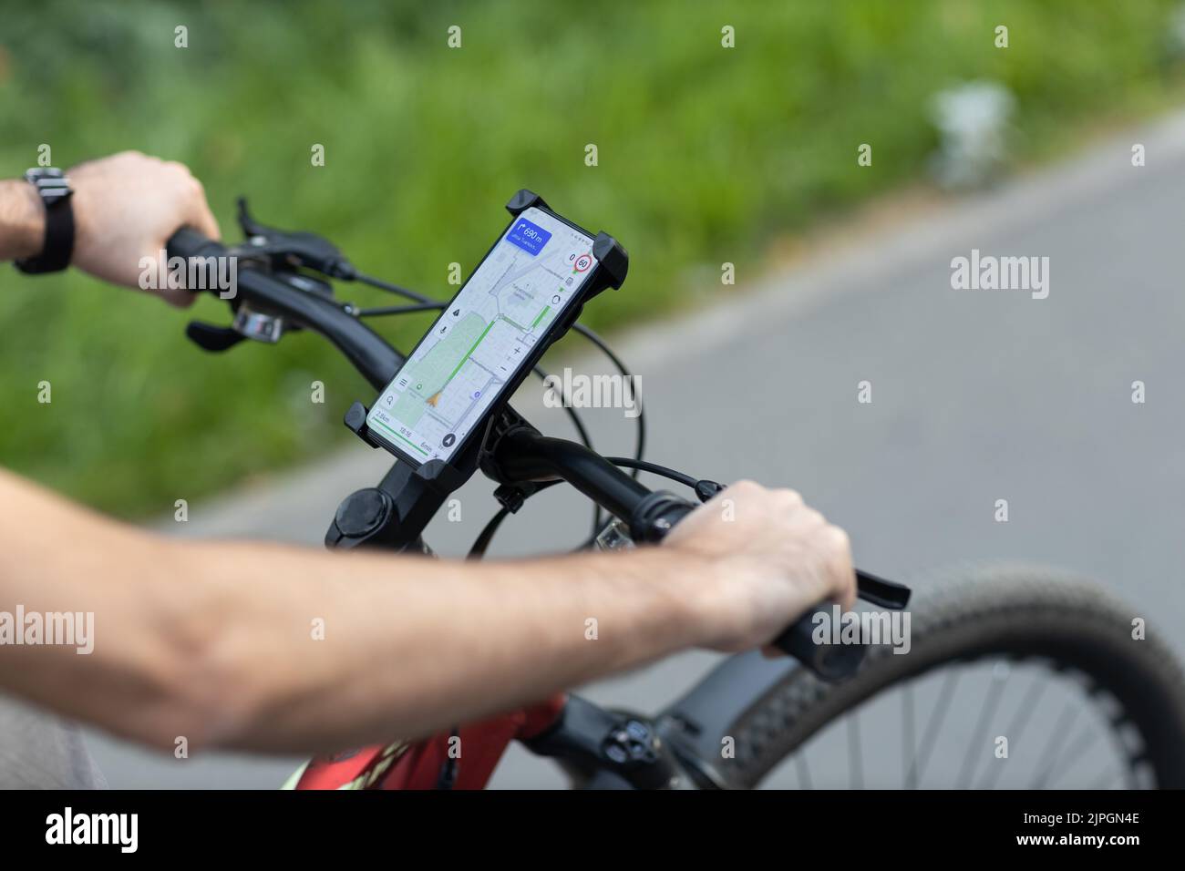 Man planning route using GPS navigation application in mobile phone on ...