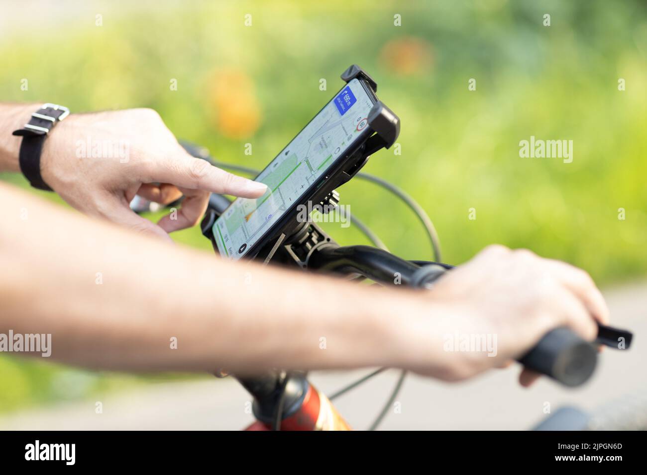 Man planning route using GPS navigation application in mobile phone on ... Man planning route using GPS navigation application in mobile phone on ...