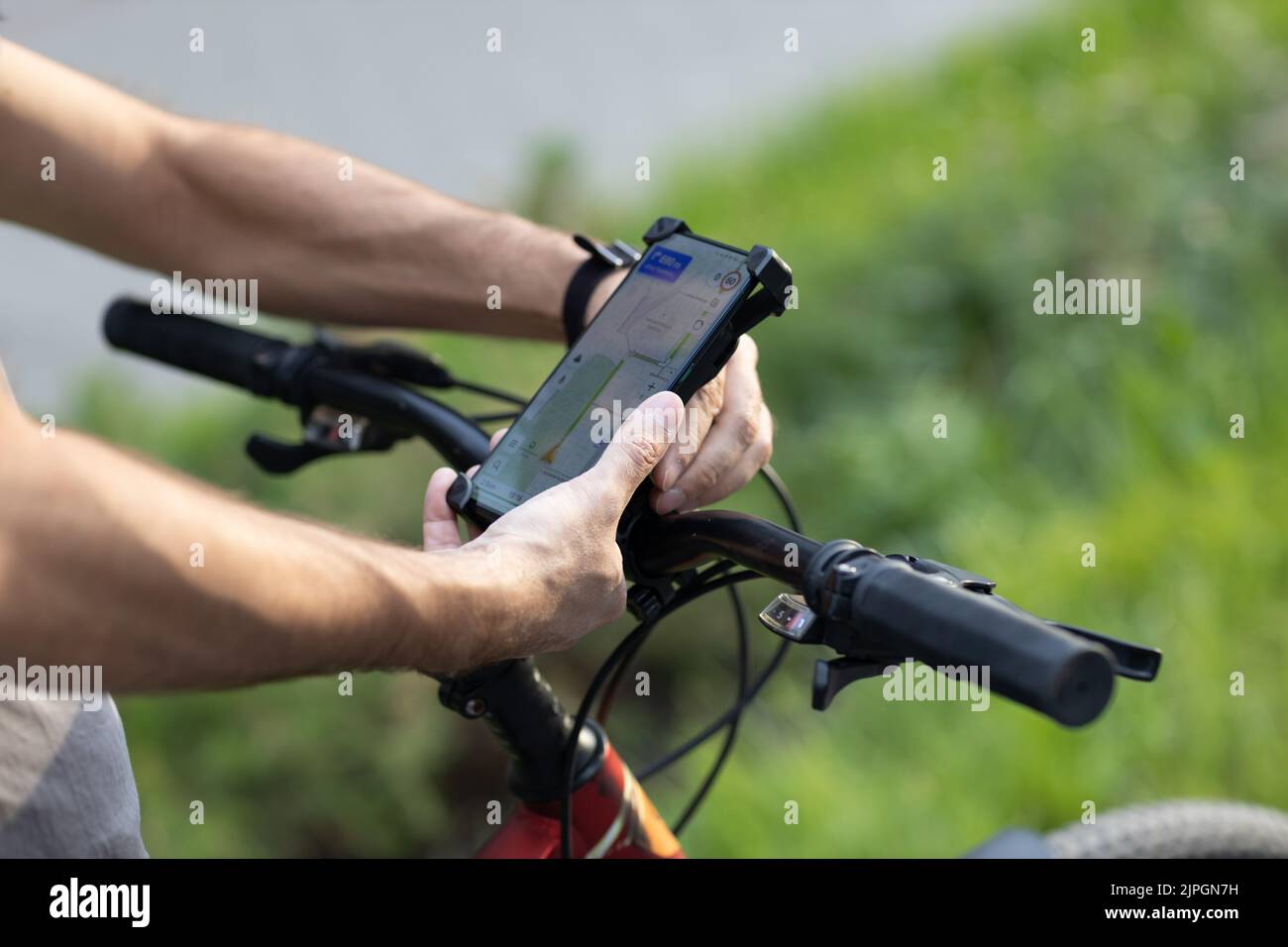 Man planning route using GPS navigation application in mobile phone on ...