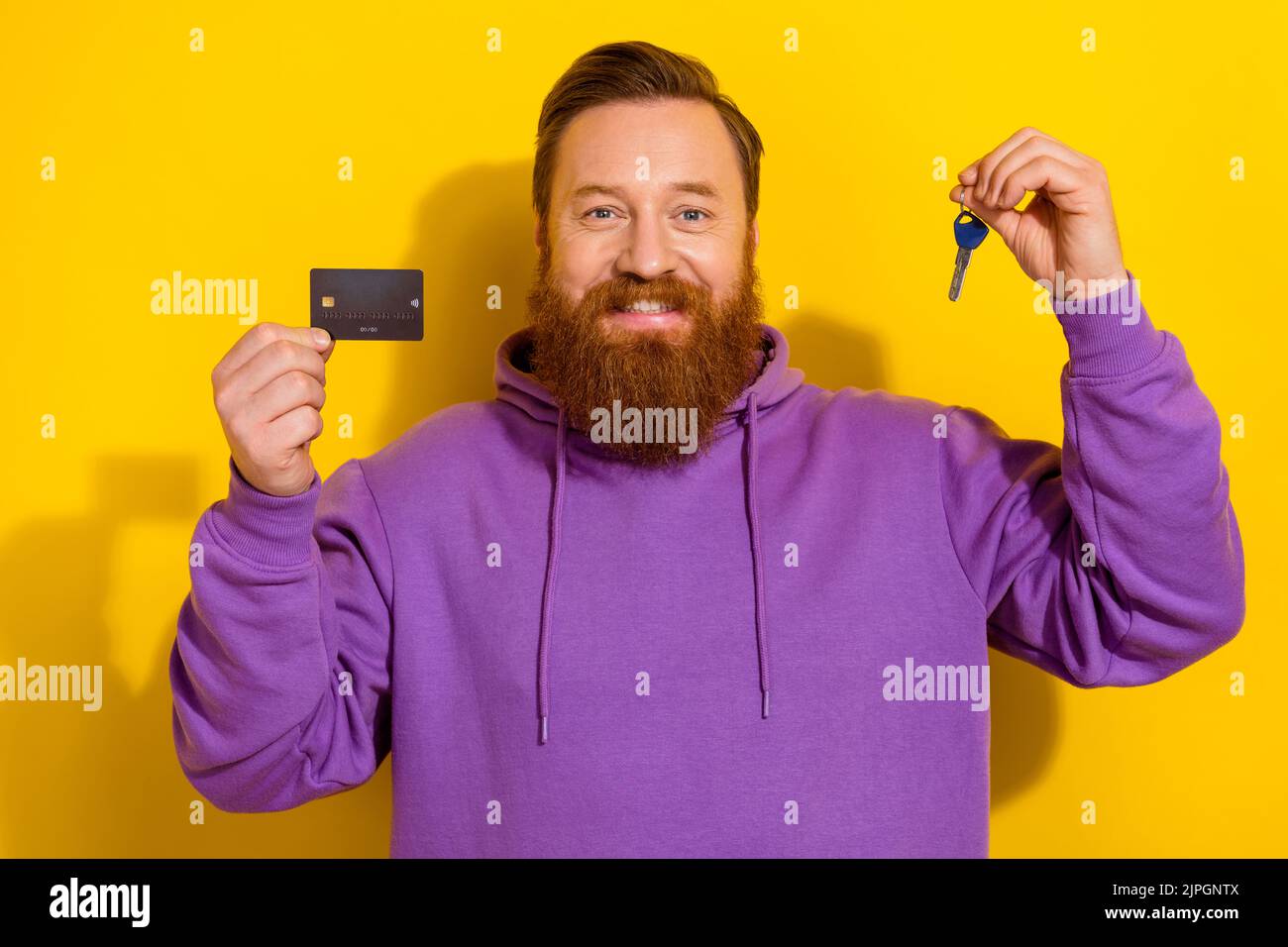 Portrait of young good mood male buy first new modern house using ...