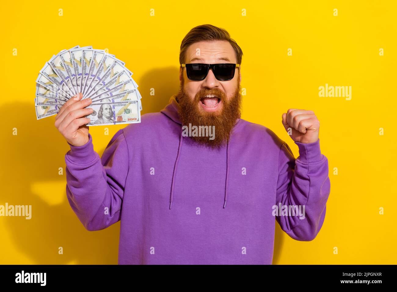 Photo of impressed lucky guy dressed purple sweater dark eyewear rising ...