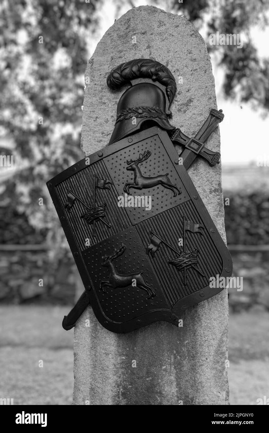 A grayscale shot of a warrior armor on the tombstone in the Marstrand ...