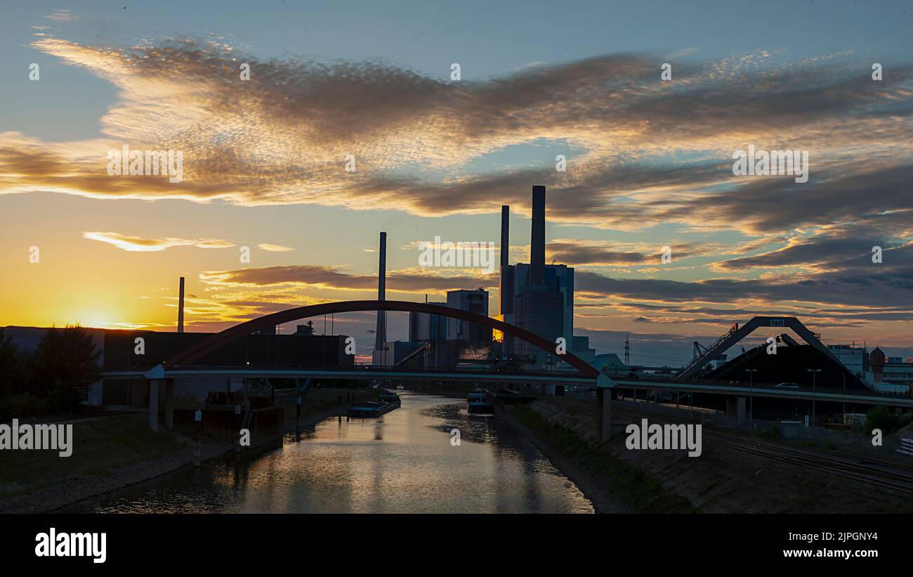The GKM Mannheim power station with a bridge and a sunset view in the ...