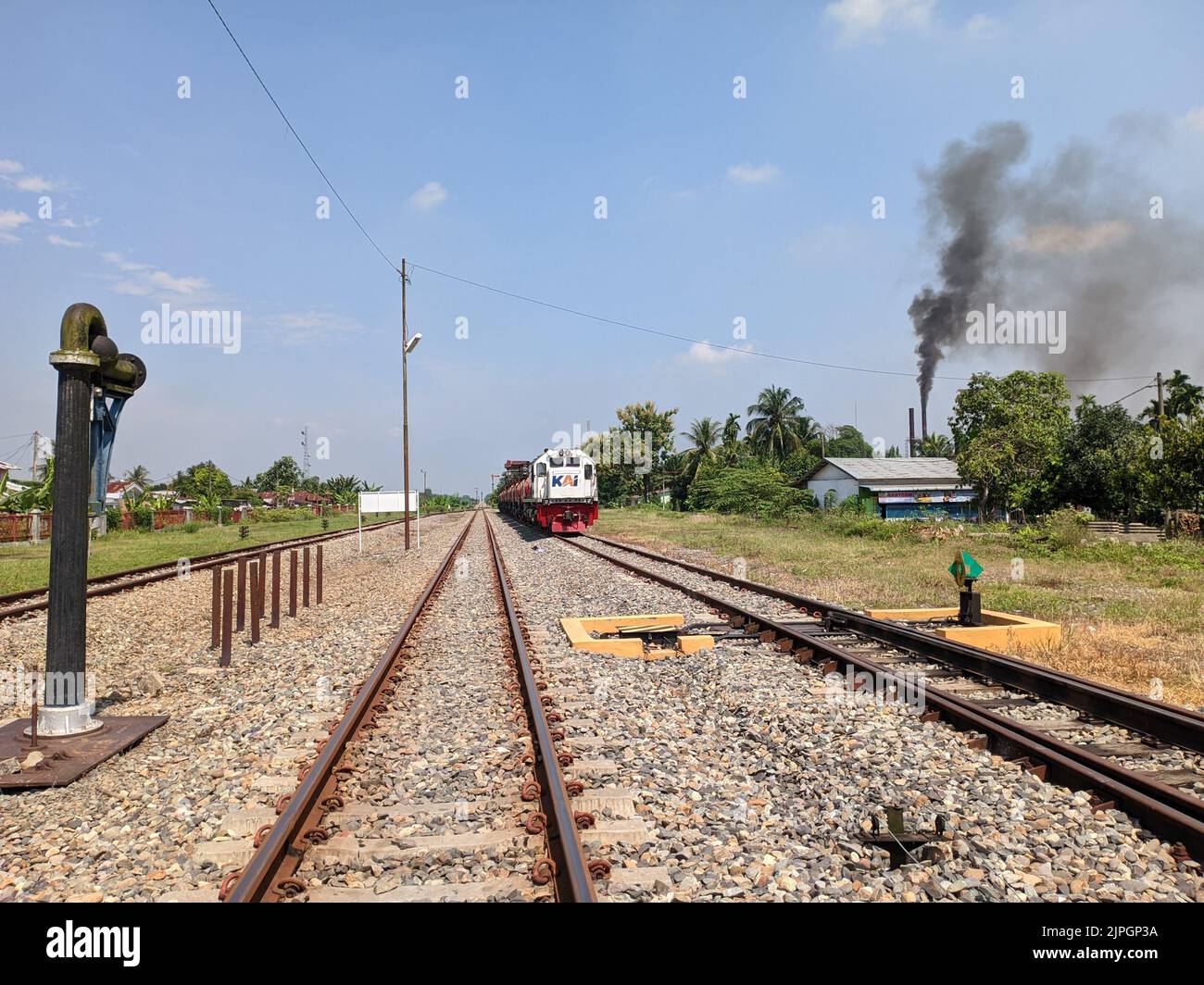 Indonesian train owned by KAI company arriving at the station with ...