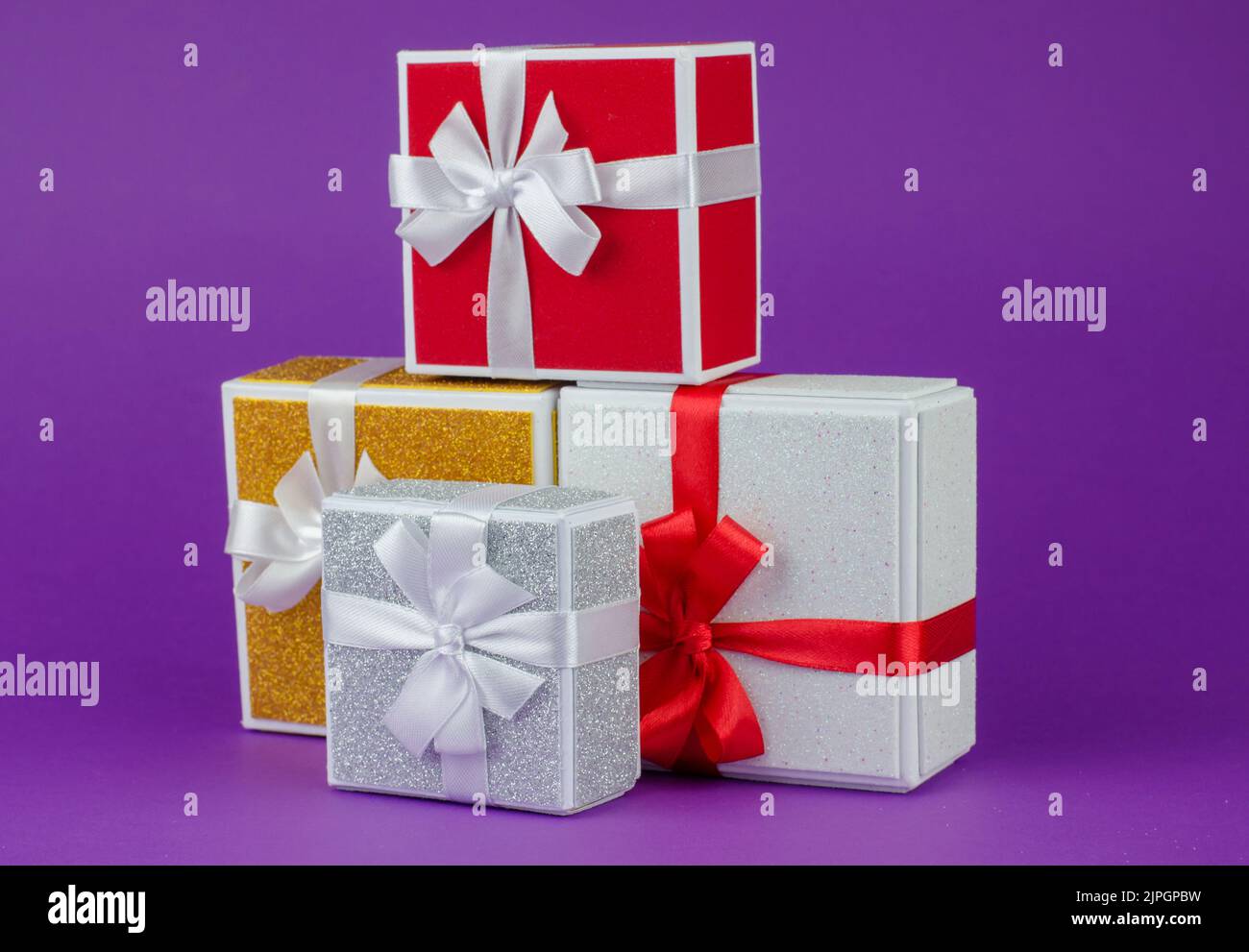 Gift boxes on a purple background. Lots of gift boxes Stock Photo - Alamy