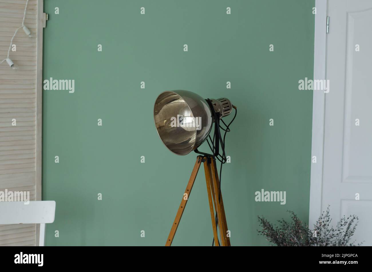 Old photo studio lamp. Old style studio light lamp on wall background ...