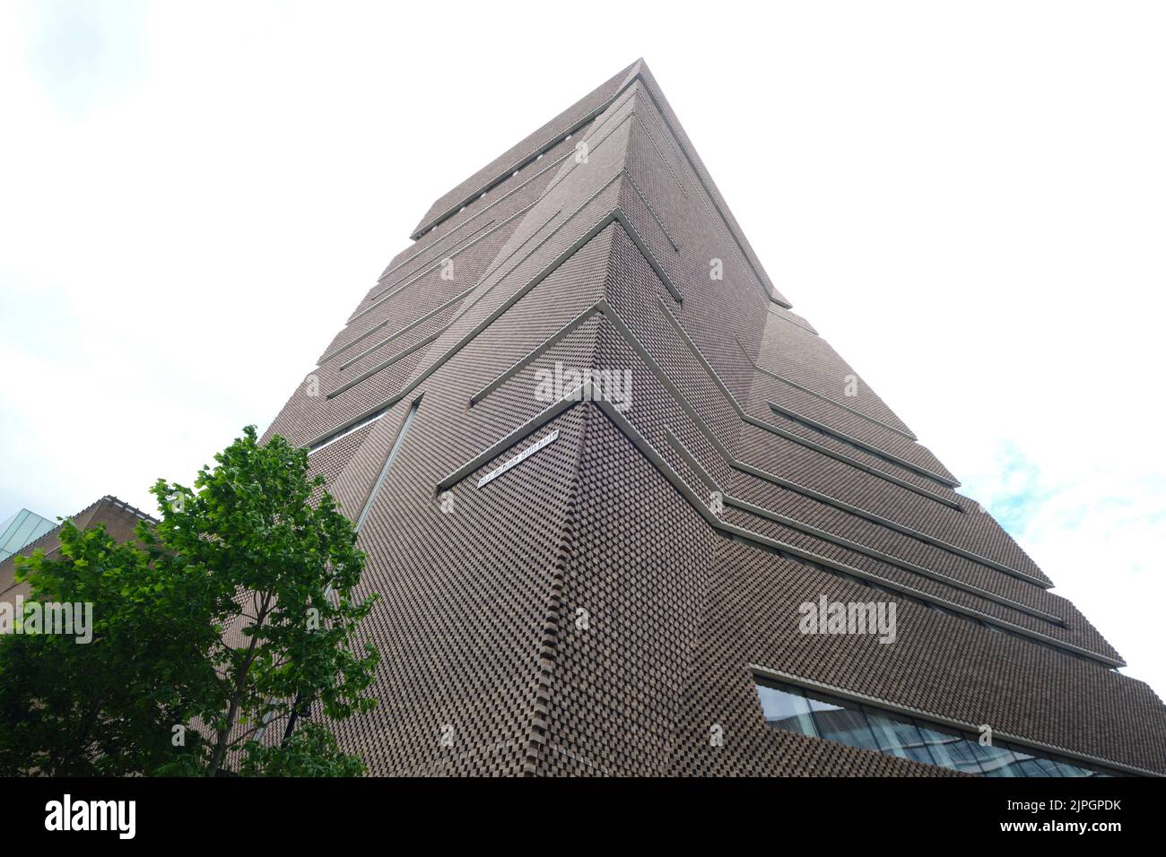 Over-exposed view of the exterior brick facade of the Herzog & de ...
