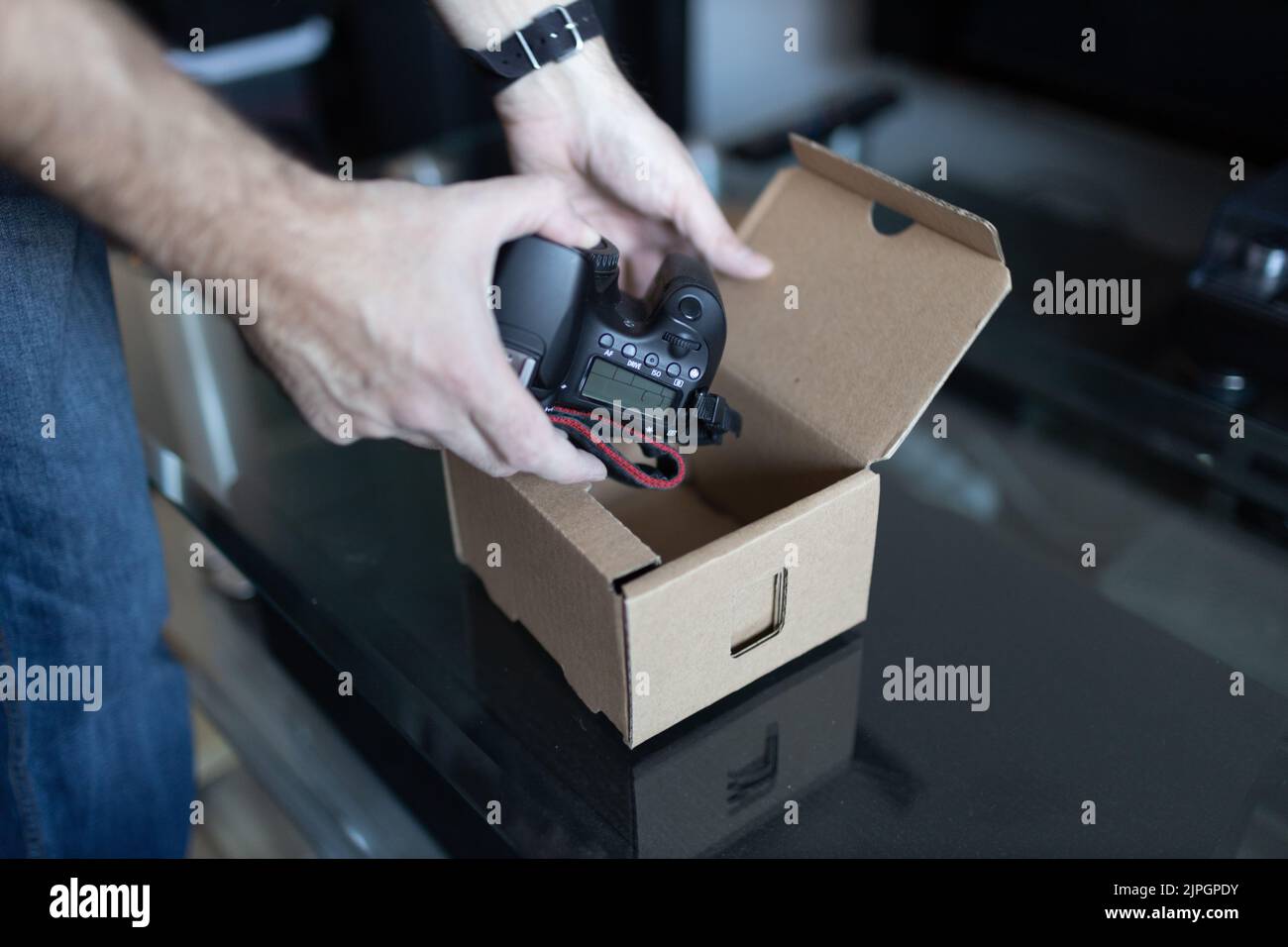 Adult man small business owner packing order box package shipping to ...