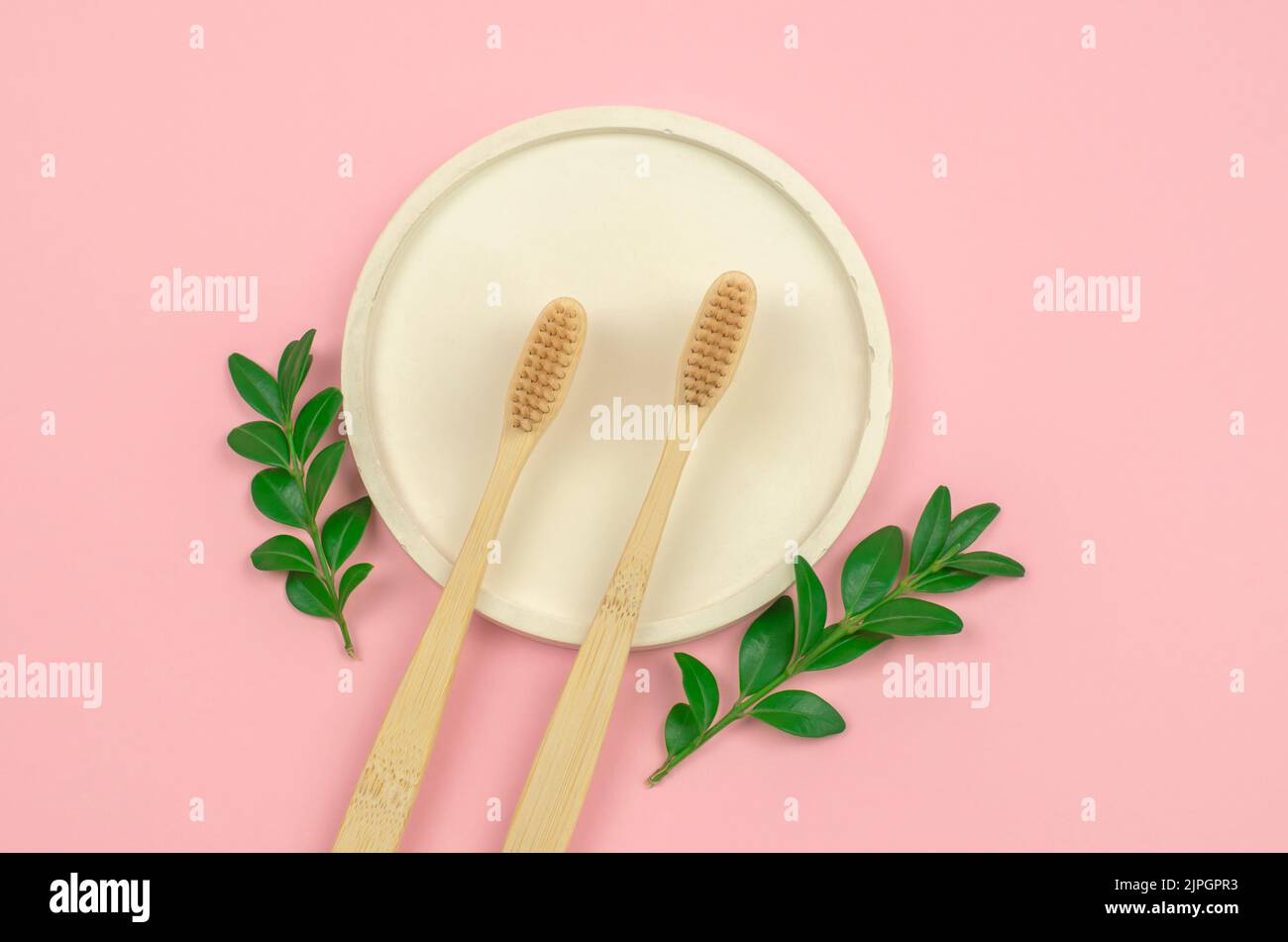 Two wooden toothbrushes on a white podium. Personal hygiene items Stock ...