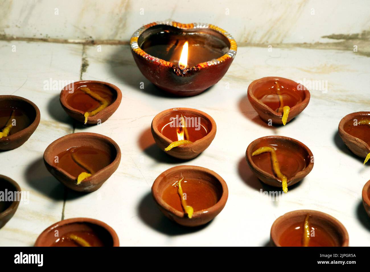 The traditional clay diya lamps lit during diwali celebration Stock ...