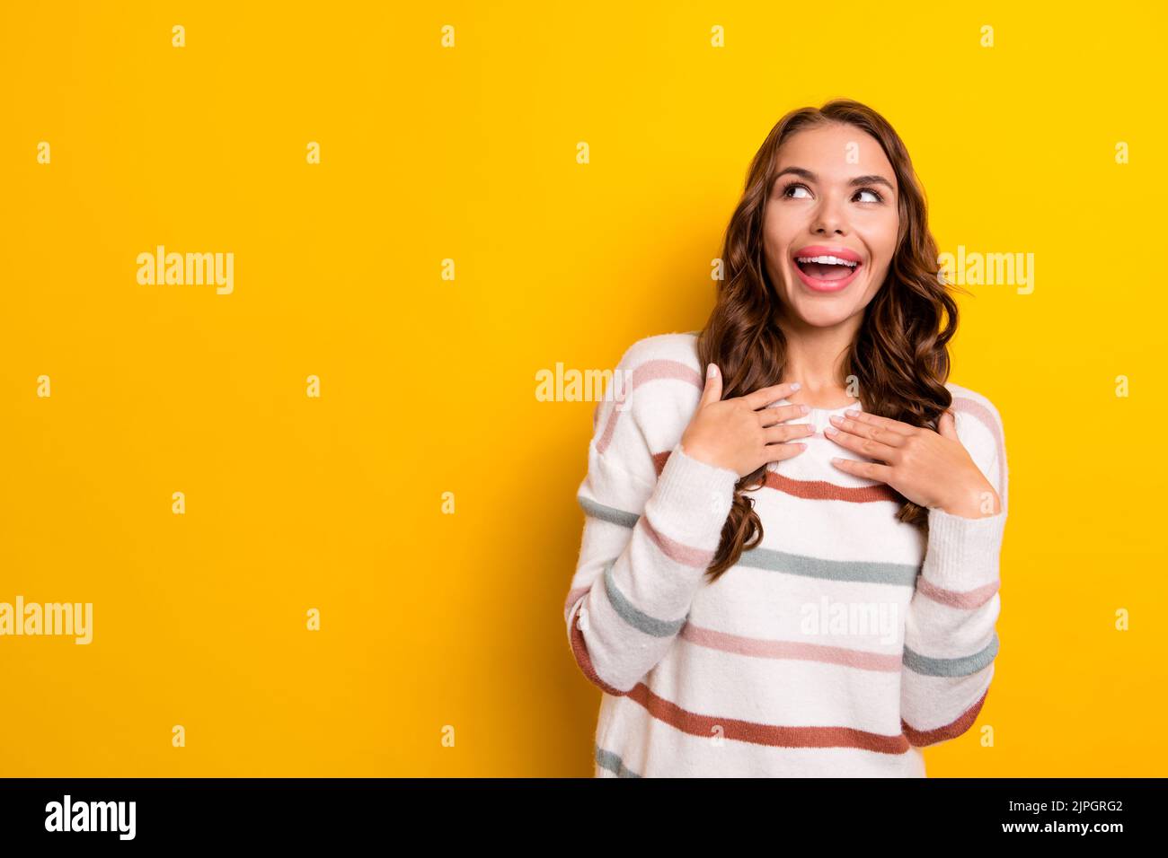 Portrait of astonished cheerful lady hands touch chest open mouth look ...