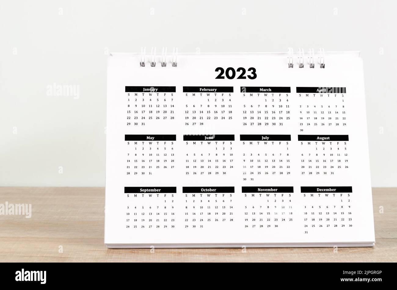 12 months desk calendar 2023 on wooden background Stock Photo - Alamy