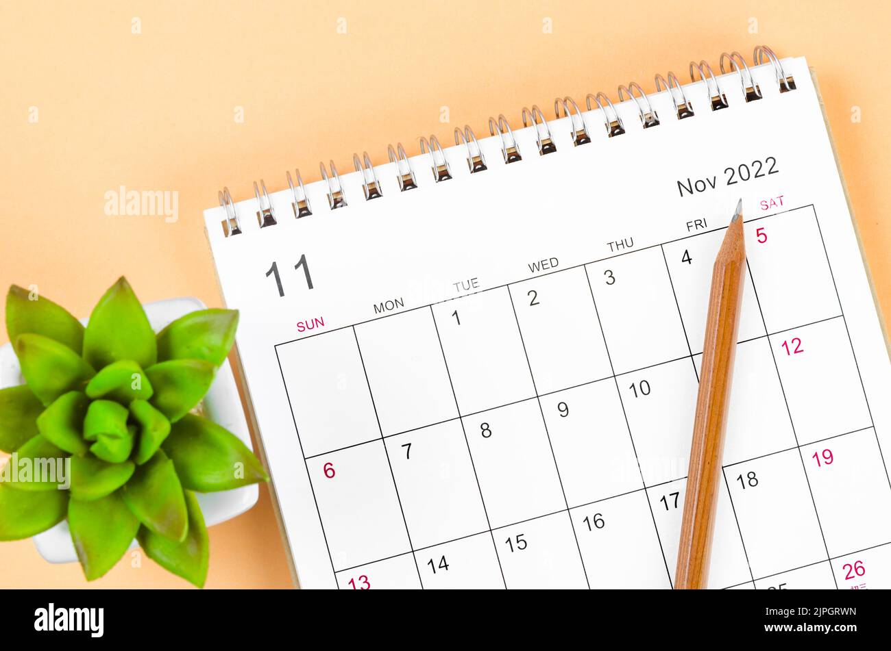 November 2022 desk calendar with wooden pencil Stock Photo - Alamy